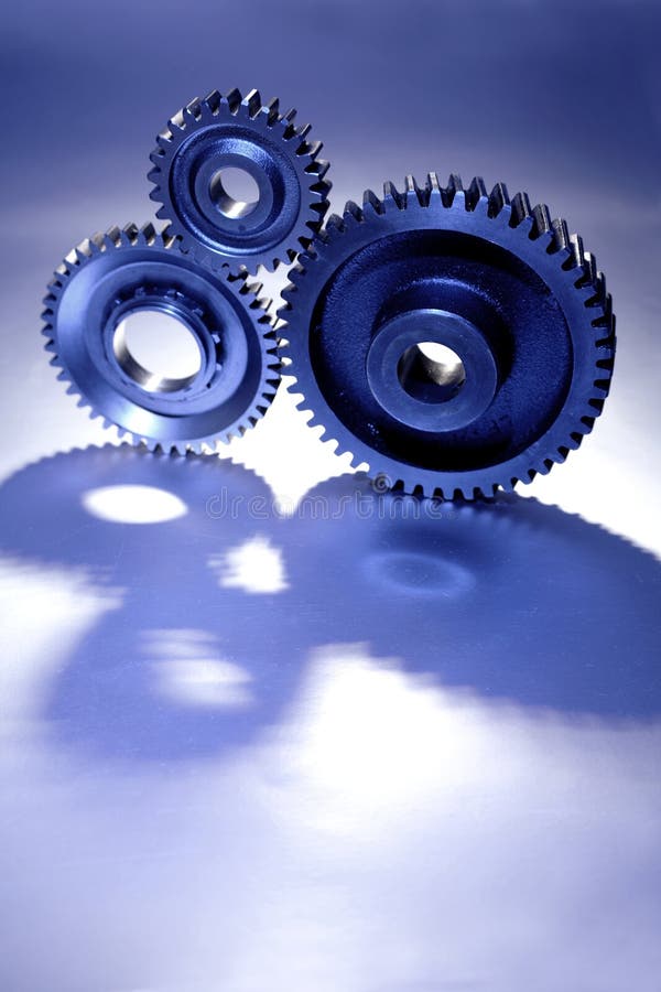 Three cogs together stock image. Image of studio, color - 3587117