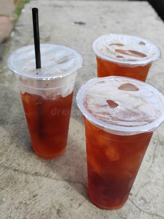 Three Cold Tea Drinks with Ice Cubes in Plastic Cups Stock Image ...