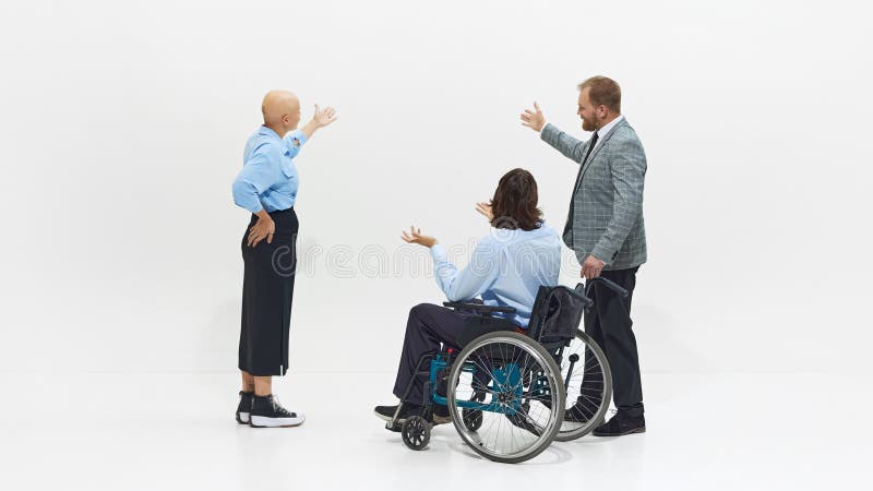 Three Colleagues Animatedly Discussing Ideas, Gesturing, Active ...