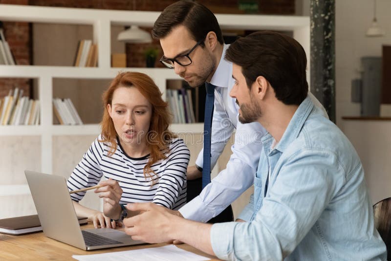 Three Colleagues at a Meeting in the Foyer of a Big Business Stock ...