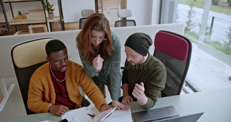 Young, Multiracial Team of Business Professionals Collaborating on a ...