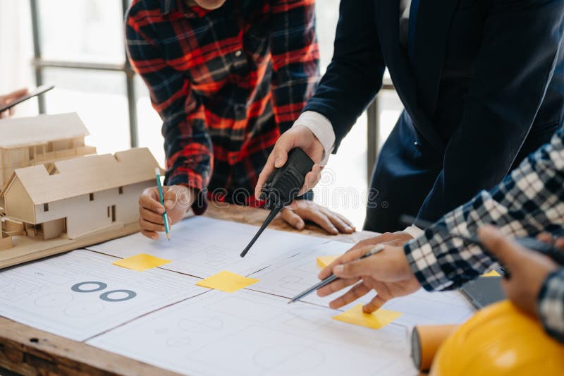 Three Colleagues Discussing Data Working and Tablet, Laptop with on on ...