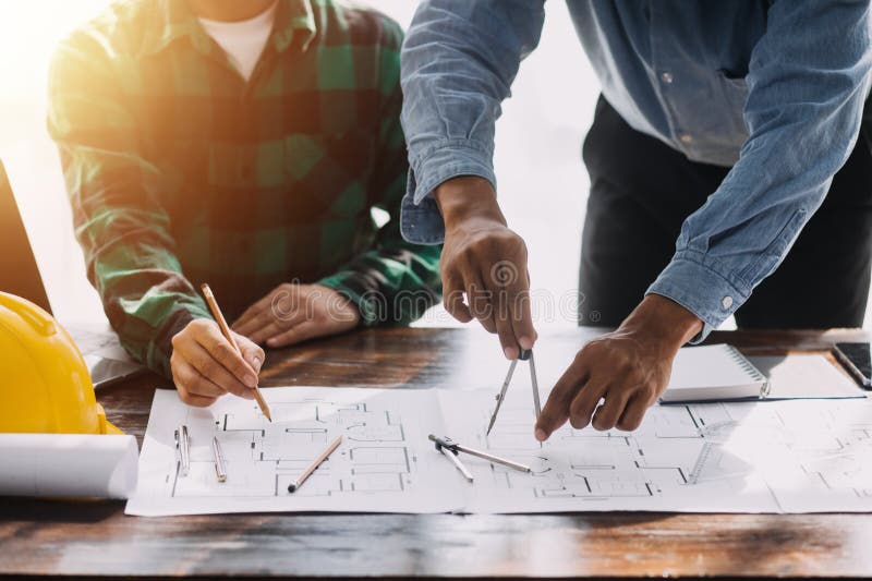 Three Colleagues Discussing Data Working and Tablet, Laptop with on on ...