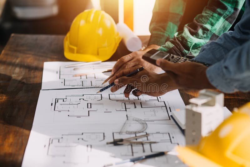 Three Colleagues Discussing Data Working and Tablet, Laptop with on on ...