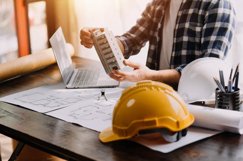 Three Colleagues Discussing Data Working and Tablet, Laptop with on on ...