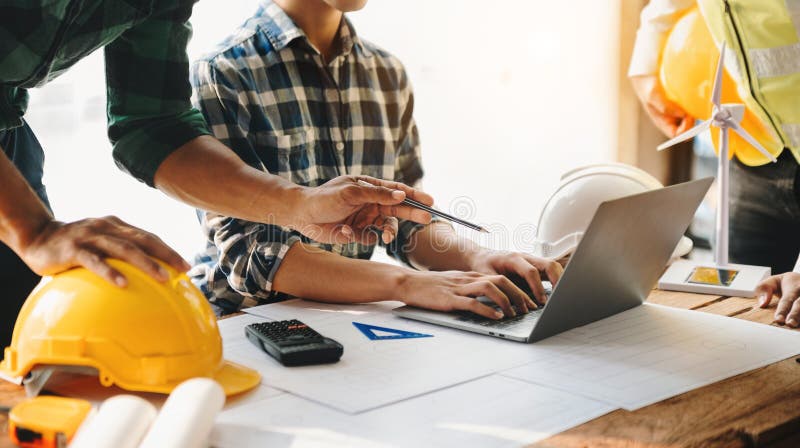 Three Colleagues Discussing Data Working and Tablet, Laptop with on on ...