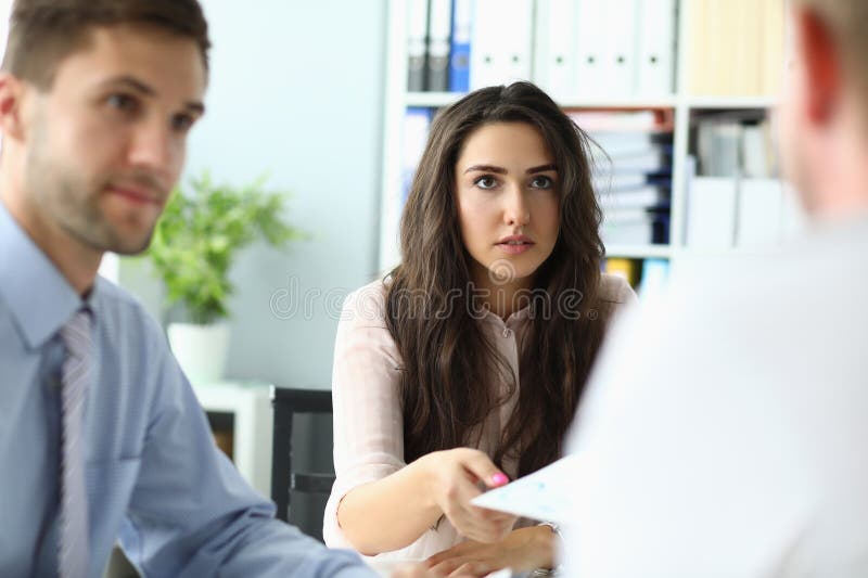 Three Colleagues are Discussing a New Business Project in Office Stock ...