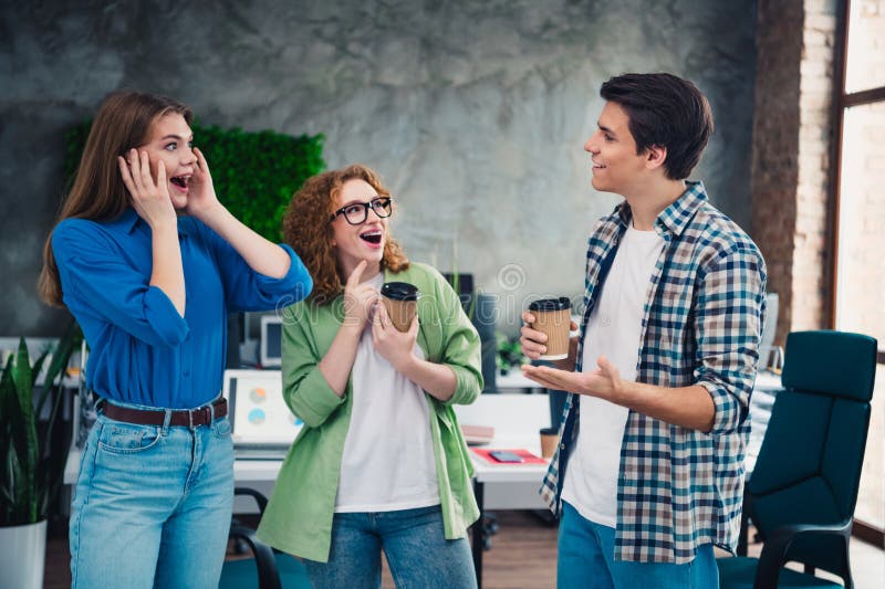 Group of Young Coworkers Enjoying a Casual Discussion in a Modern ...