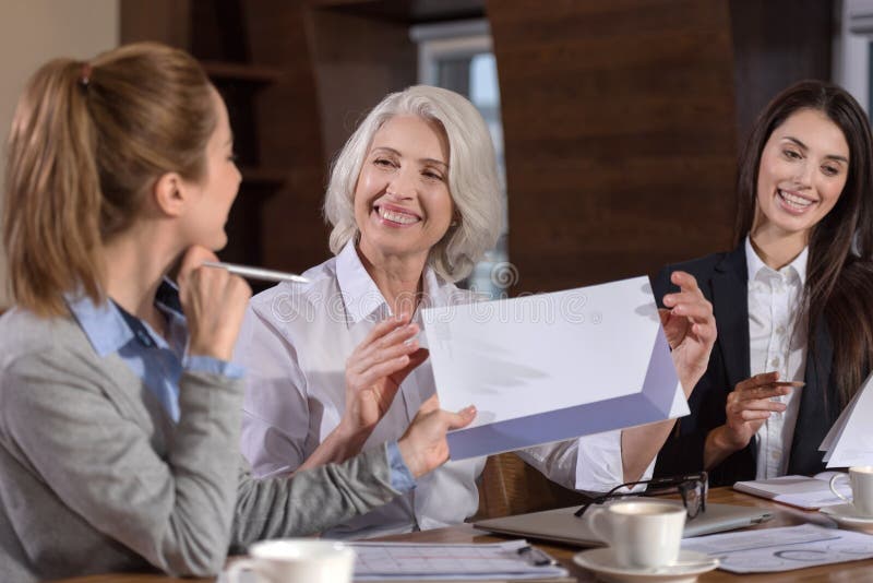 Three Colleagues Enjoying Conversation about Work Stock Image - Image ...