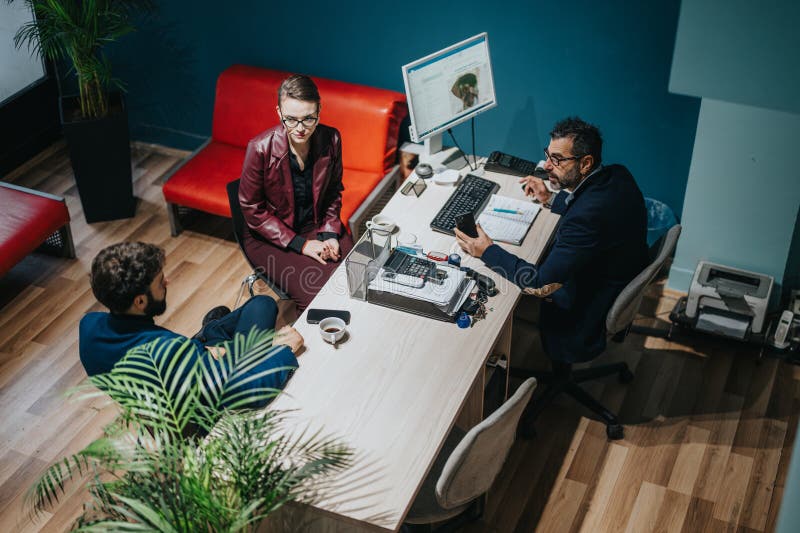 Business People Engaged in Conversation during a Formal Meeting in an ...