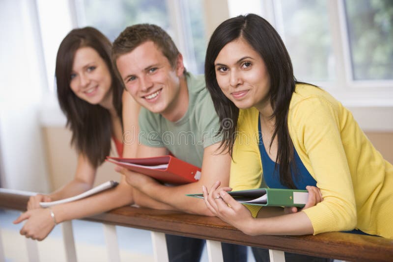 Three College Students Leaning on Banister Stock Image - Image of ...