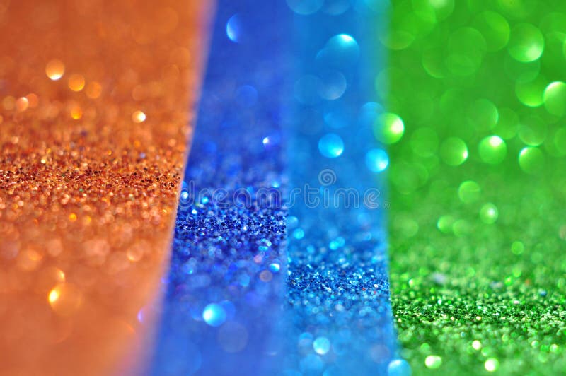 Three Color Abstract Bokeh with Orange, Blue and Green on Glittering ...