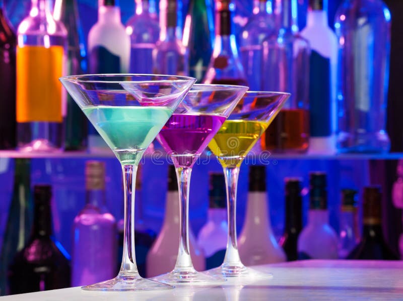 Three Color Cocktail Glasses on the Bar Table Stock Image - Image of ...