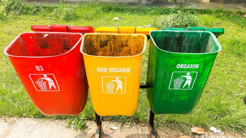 Three Trash Cans Green, Yellow and Red Stock Image - Image of clothing ...