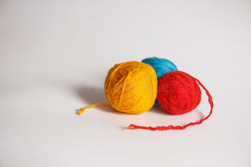 Three Colored Balls of Thread on White Background Stock Photo - Image ...