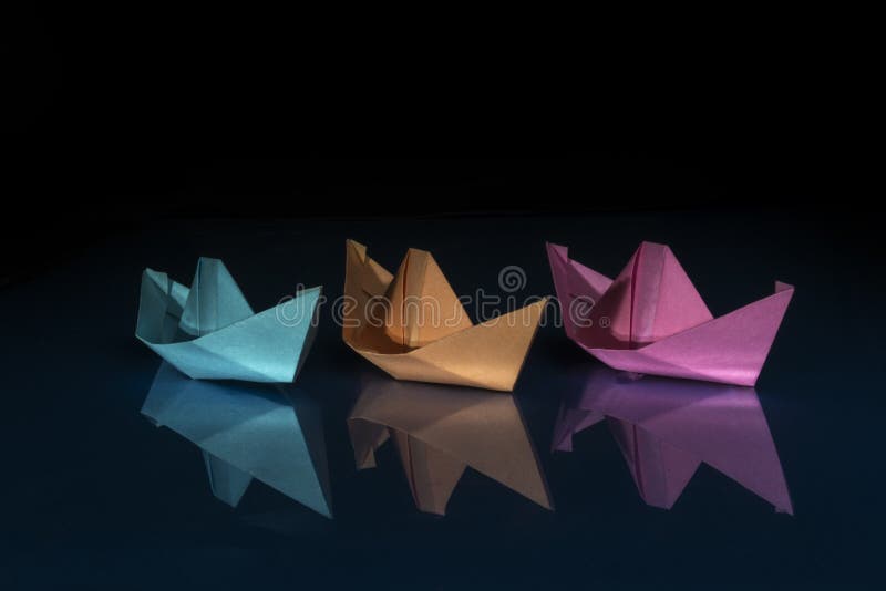 Three colored paper boats stock image. Image of sailing - 67288909