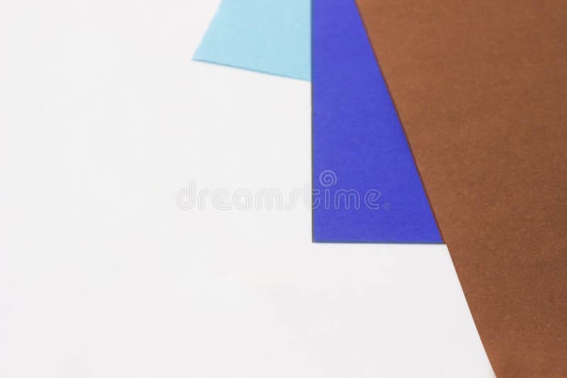 Three Colored Papers with Blue, Violet and Brown Colors on White in the ...