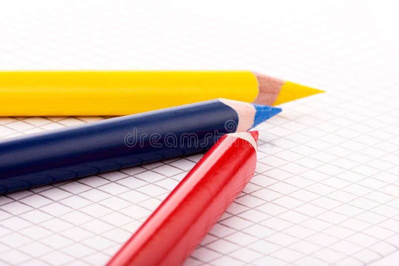 Three Colored Pencil on Squared Paper Stock Photo - Image of squared ...