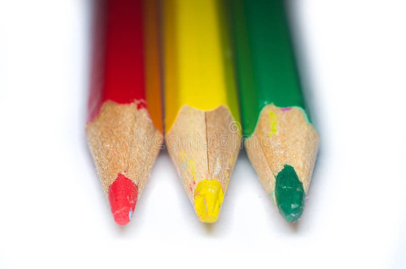 Three colored pencils stock photo. Image of green, three - 47293654