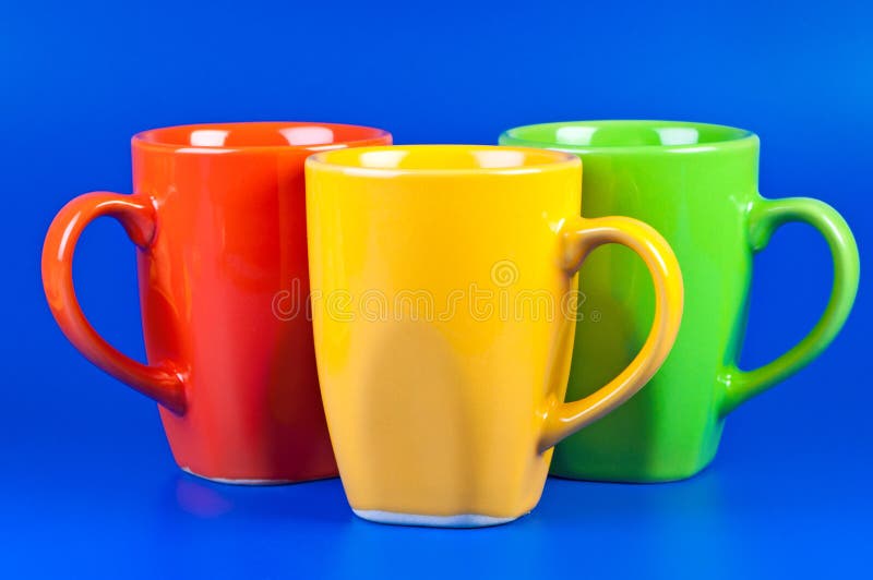 Three Tea Cups. Red, Yellow and Green Stock Image - Image of blue ...