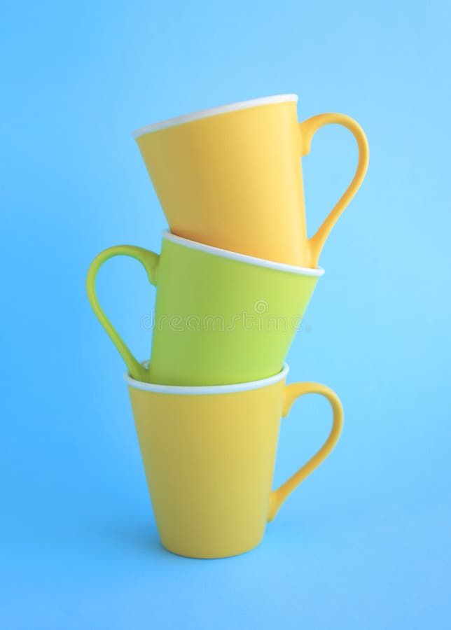 Three Colorful Cups On Blue Stock Photo - Image of drink, group: 143934188