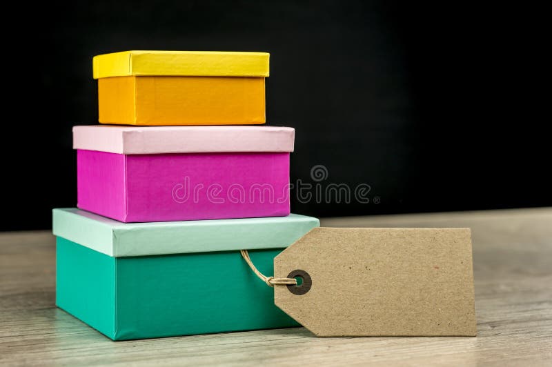 Three Colorful Nesting Gift Boxes and Tag Stock Photo - Image of ...
