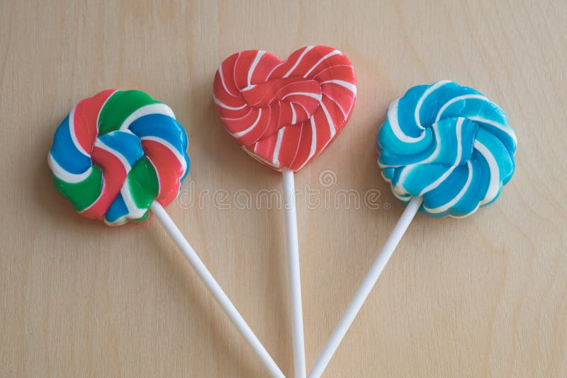 Three Colorful Spiral Lollipops Stock Image - Image of childhood, taste ... Three Colorful Spiral Lollipops Stock Image - Image of childhood, taste ...