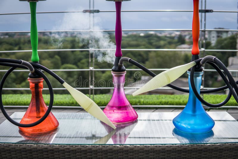 Three Colors Hookahs on Table in Hookah Lounge in a Day. Stock Photo ...