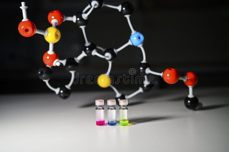 Different Colorful Solution in Conical Flask on a Bench in a Chemistry ...