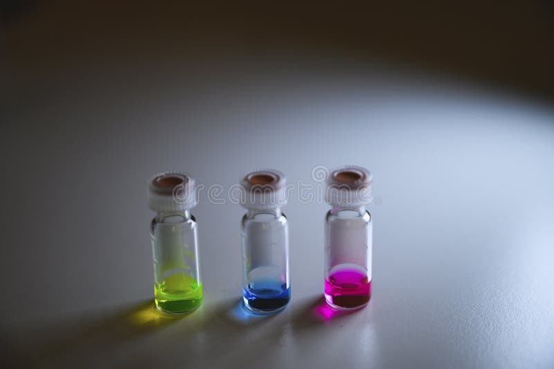 Different Colorful Solution in Conical Flask on a Bench in a Chemistry ...