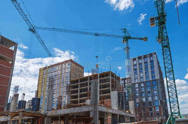 Three construction cranes stock image. Image of buildings - 211693305