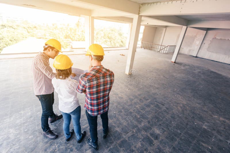 Three Construction Engineers Working Together in Construction Si Stock ...
