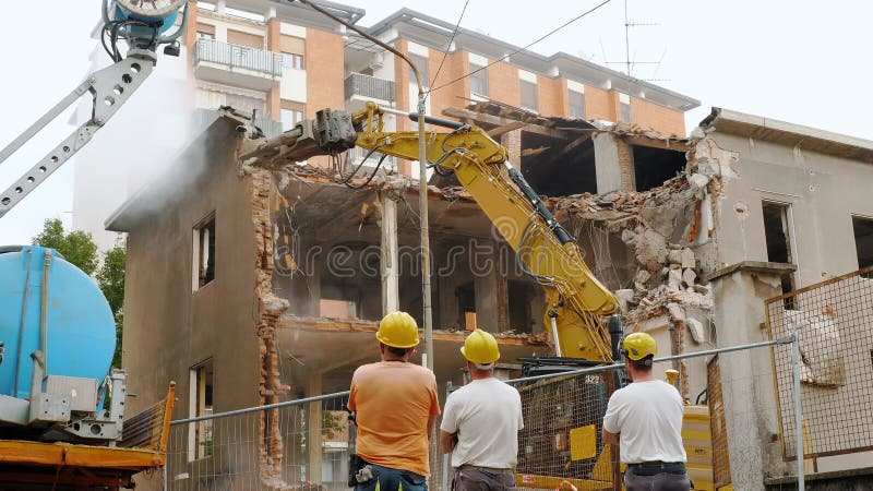 Construction Workers Overseeing the Demolition of an Urban Building ...