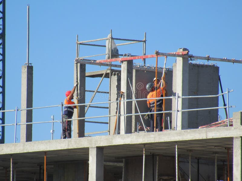 Construction Workers on a Construction Site. Bricklayers Stock Photo ...