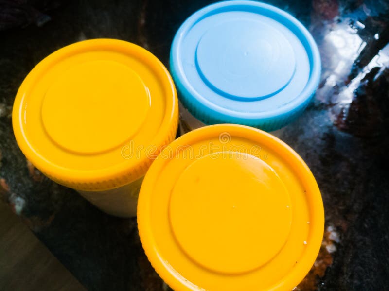 Three Containers Placed in a Table Making a Triangle Shape. Stock Image ...