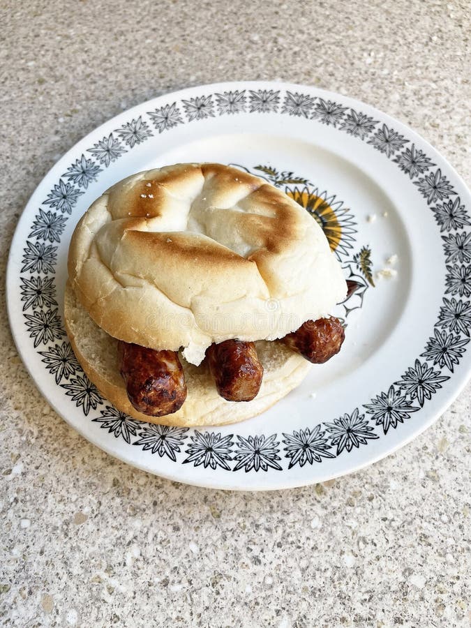 Three Cooked Sausages in a Bread Bap or Roll. Stock Image - Image of ...