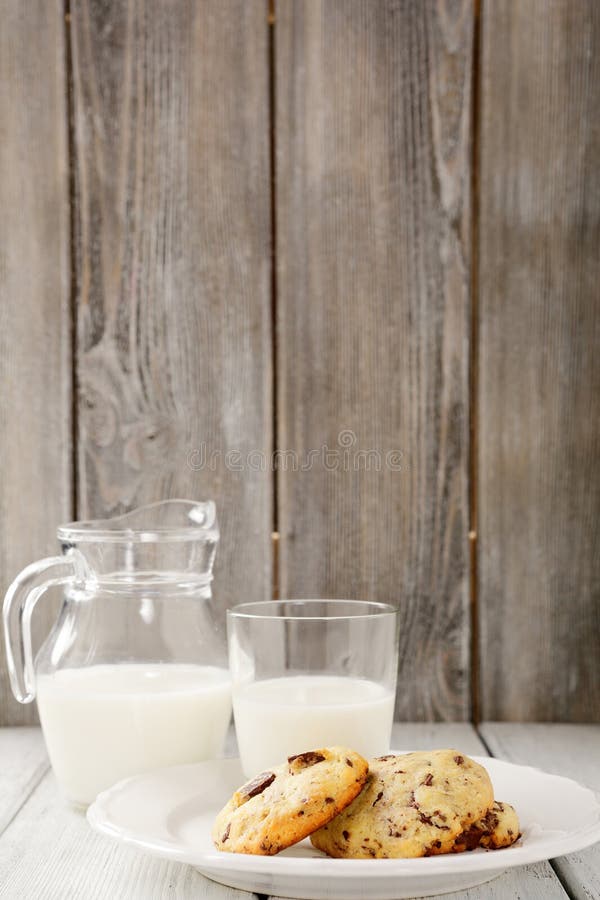 Three Cookies on a Plate with Milk Stock Photo - Image of baked ...
