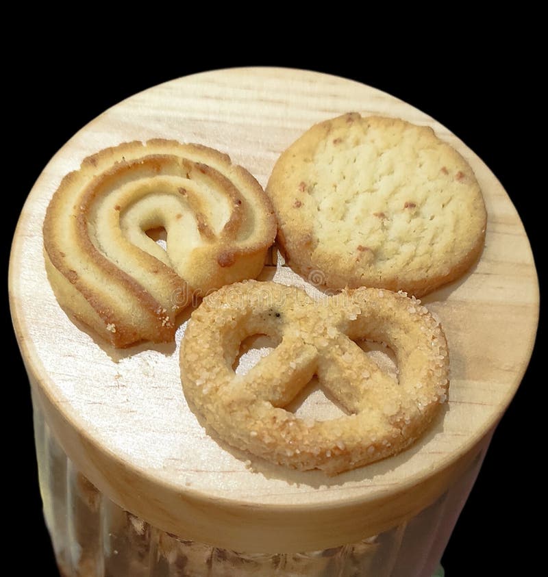 Three Cookies on Top of a Jar with a Good Taste of Cheese Stock Image ...