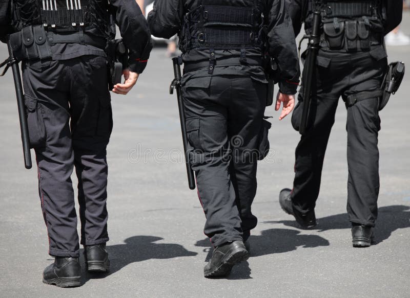 Three Cops Patroling the Road Stock Image - Image of terrorism, uniform ...