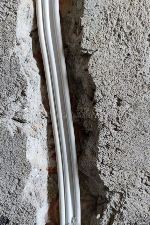 Three-core Electrical Cable in a Groove in a Concrete Wall Stock ...