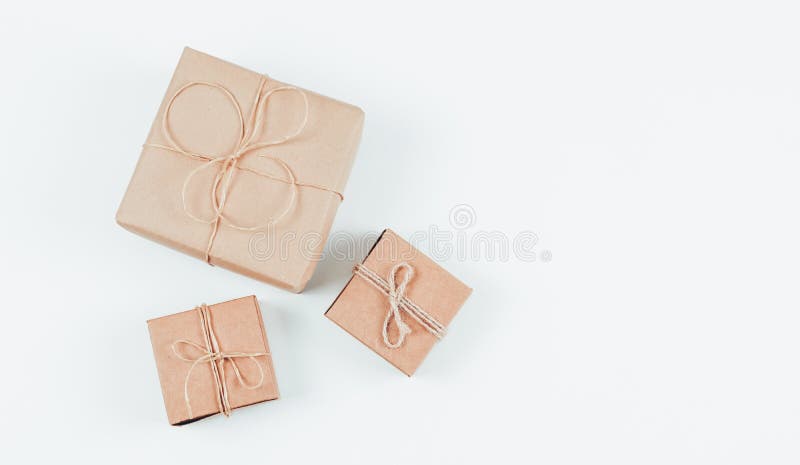 Three Craft Gift Boxes with Jute Thread Lie on the Left Against a White ...