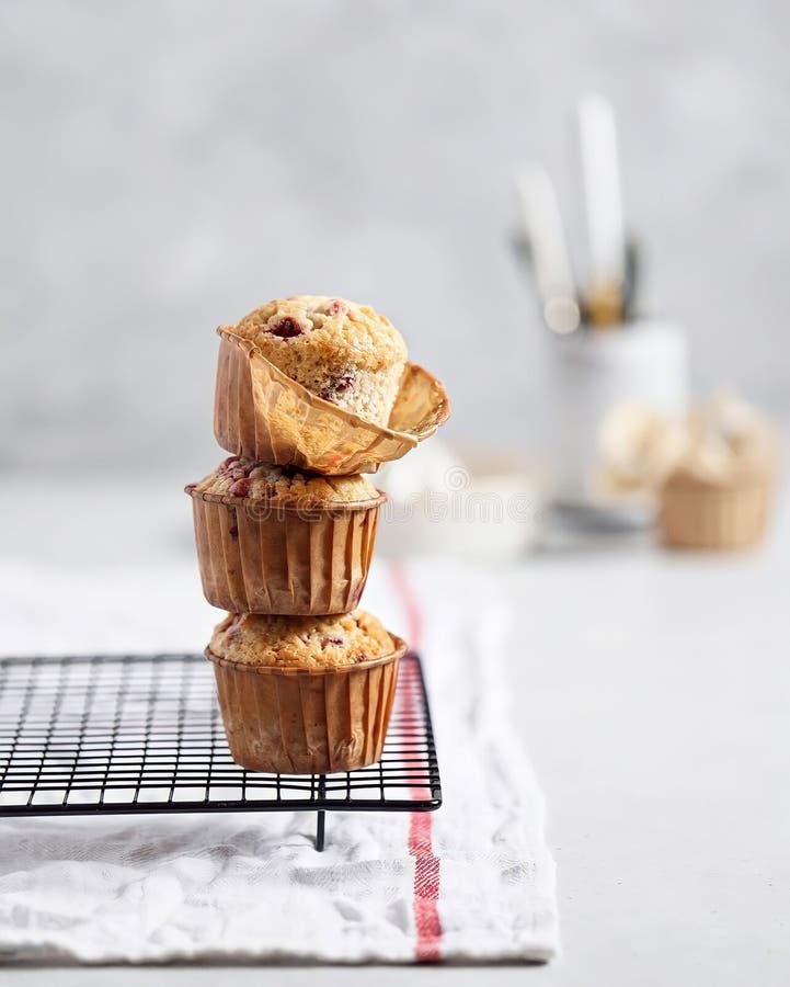Three Cranberry Muffins, Baked in Paper Liners, are Stacked on a Black ...