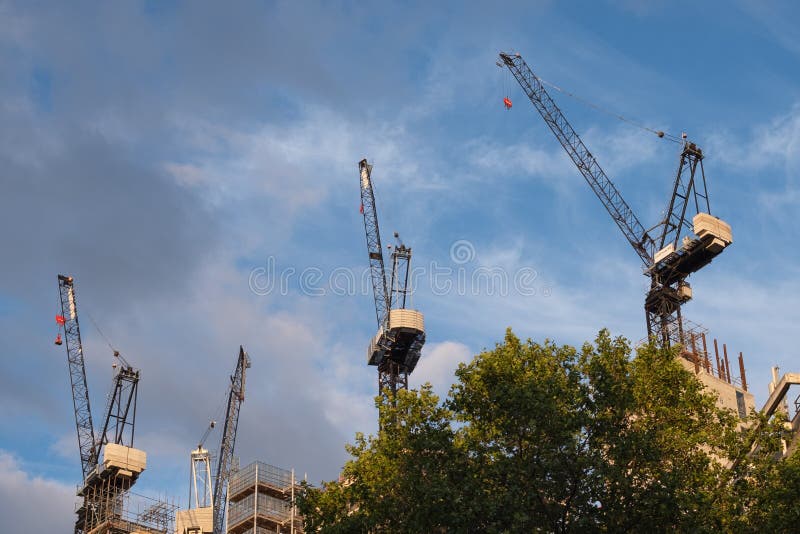 Three Cranes on High Rise Construction Site in London Stock Photo ...