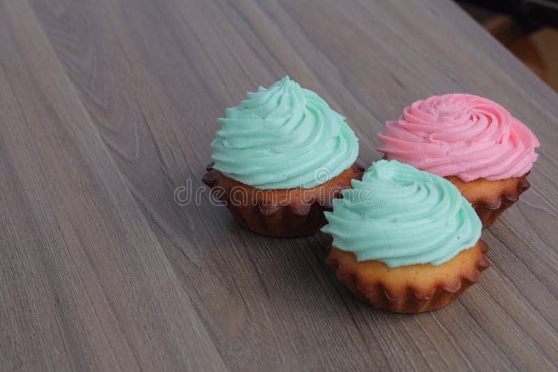 Three Cream Cakes of Different Colors. Stand by a Triangle Stock Photo ...
