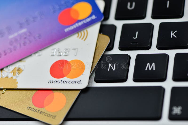 Three Credit Cards on a Computer Keyboard Editorial Stock Image - Image ...
