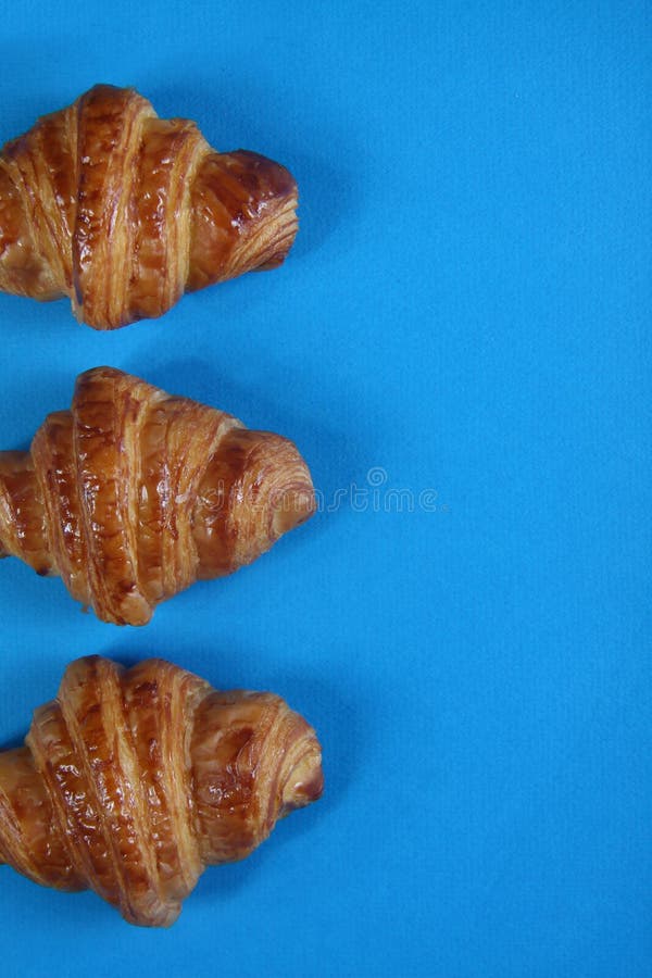 Croissant on Blue Background. Horizontal Image Stock Image - Image of ...