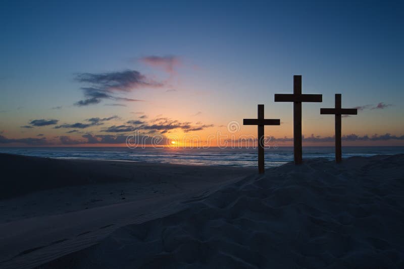 Three Crosses on Sand Dune Next To the Ocean with a Cloudy Sunrise ...
