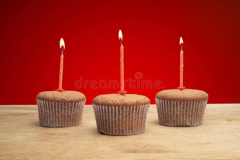 Three Cupcakes with Candles Stock Photo - Image of frosting, copyspace ...