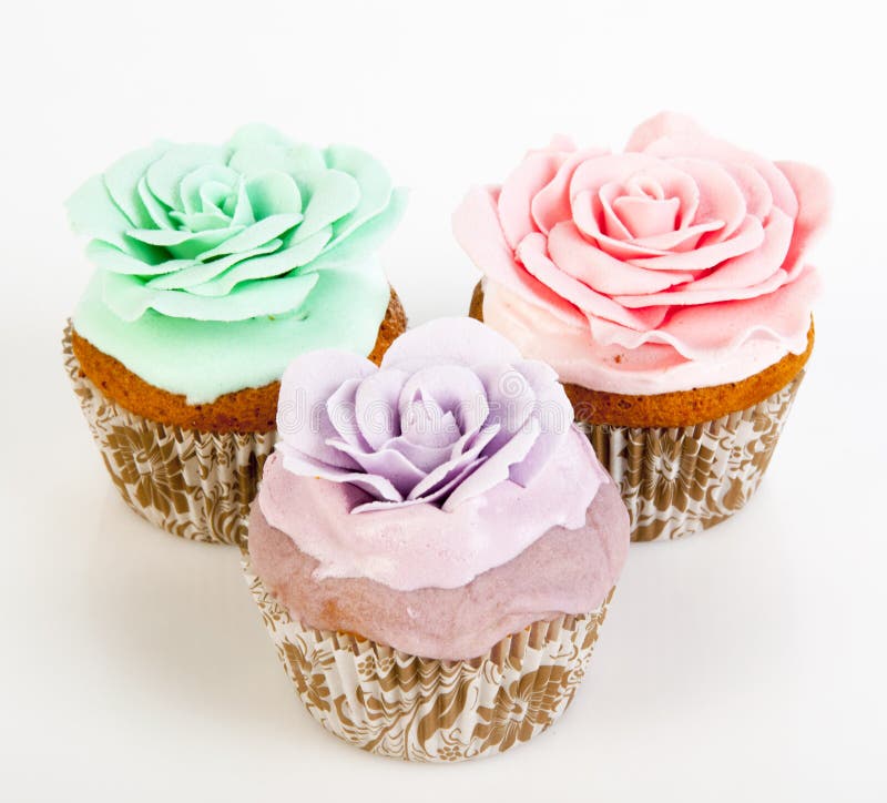 Three cupcakes with roses stock image. Image of fresh - 33653661