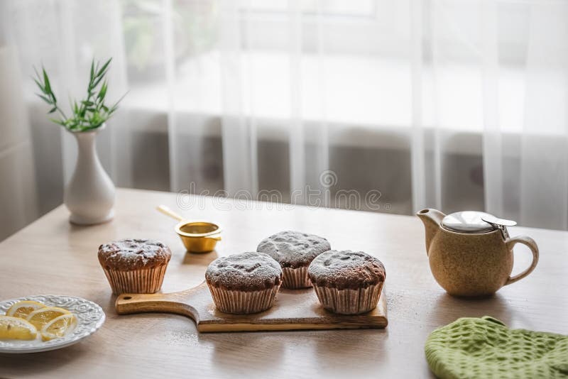Three Cupcakes on a Rustic Table Near the Window. Back Light Stock ...